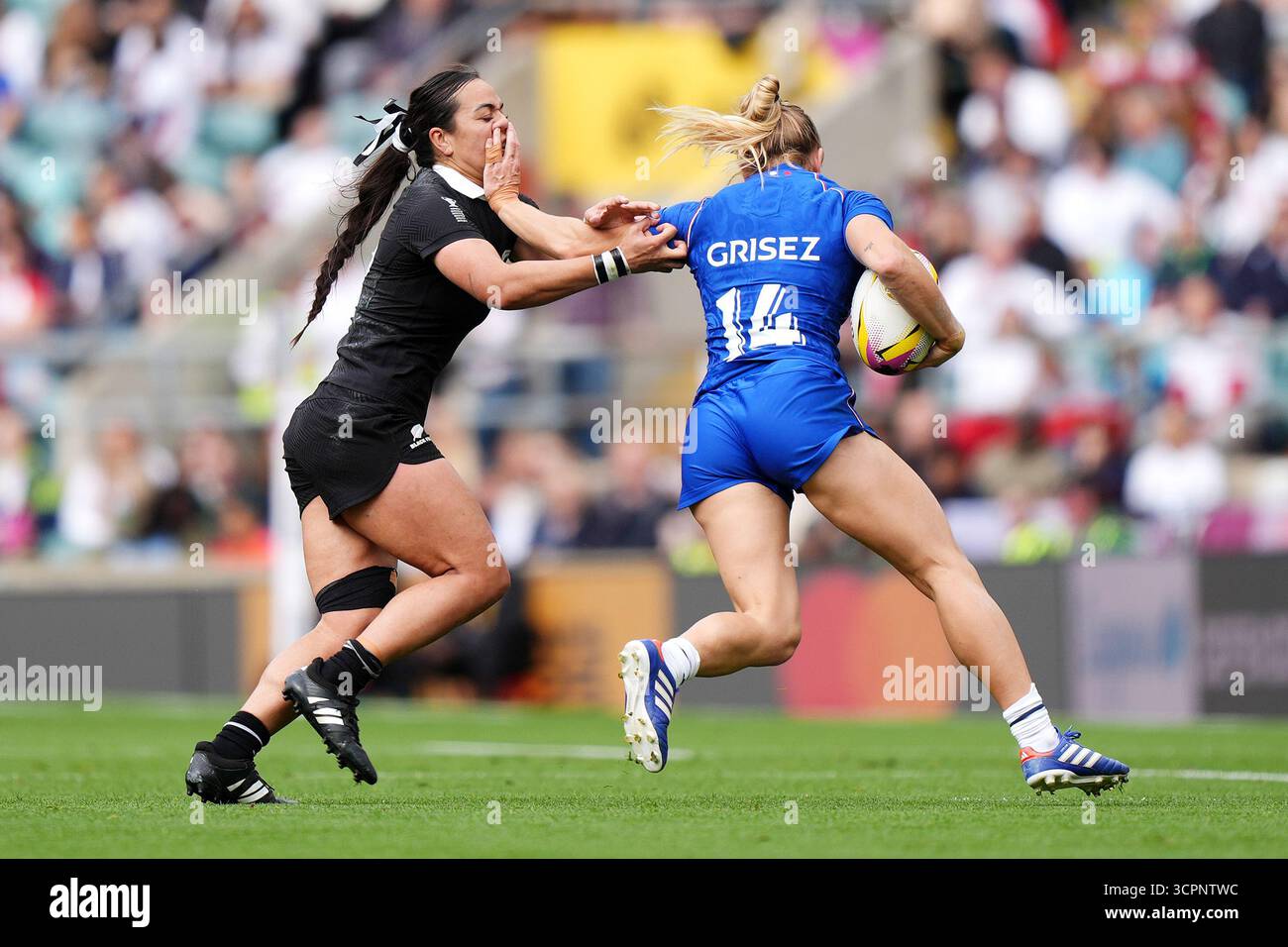 France's Nassira Konde (right) evades the challenge from New Zealand's ...