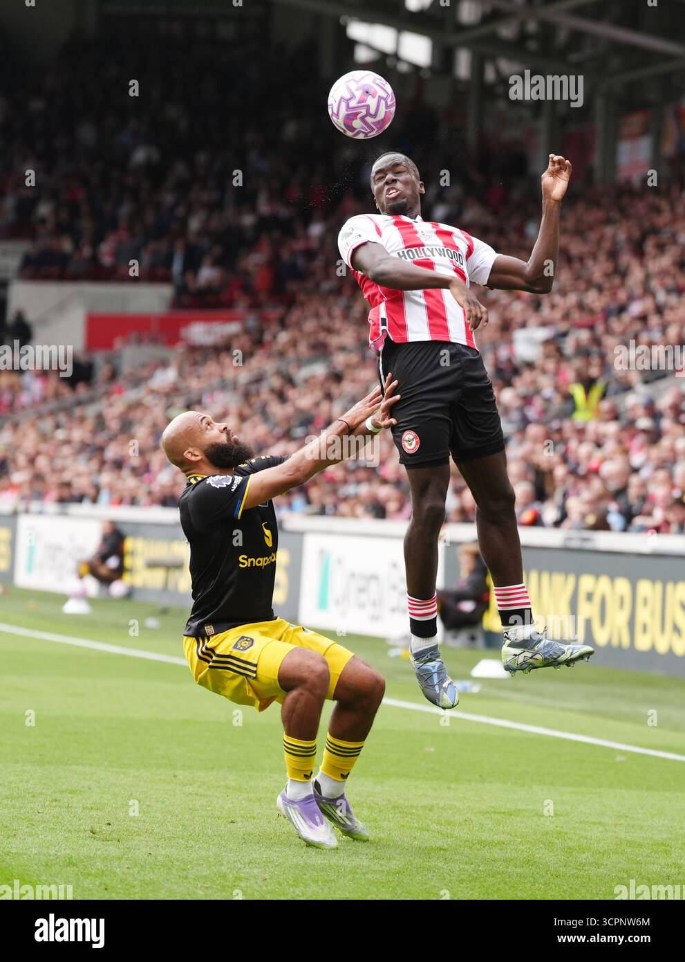 Manchester United's Bryan Mbeumo and Brentford's Michael Kayode battle ...
