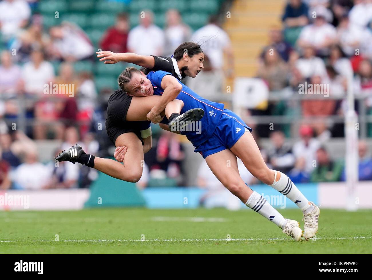 New Zealand's Braxton Sorensen-McGee (left) is tackled by France's ...