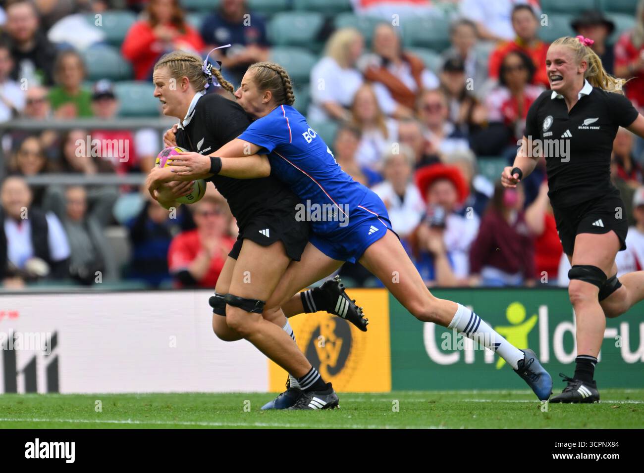 Emilie Boulard of France, right, tackles New Zealand's Laura Bayfield ...
