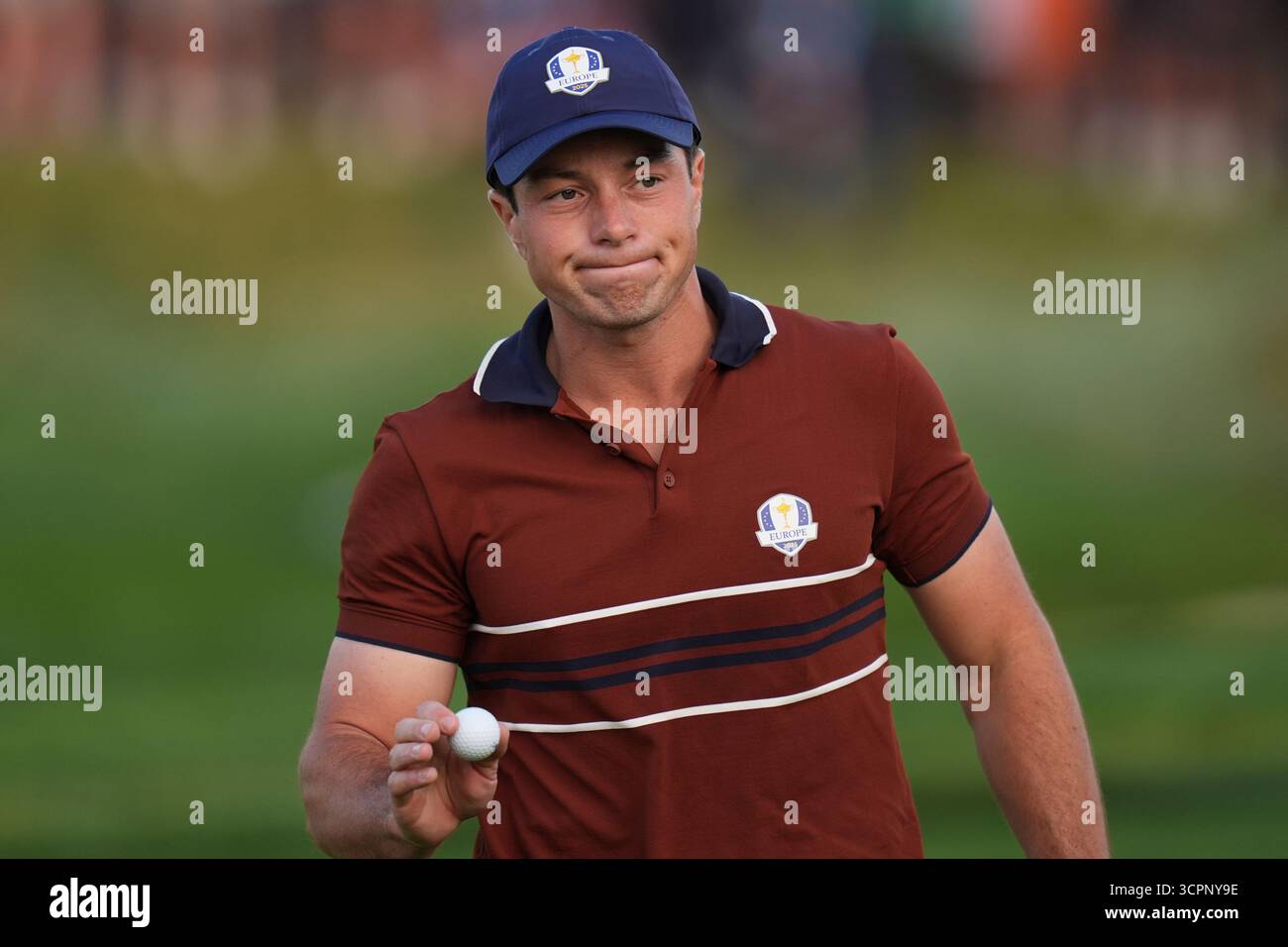 Europe's Viktor Hovland waves after making a putt on the second hole at ...