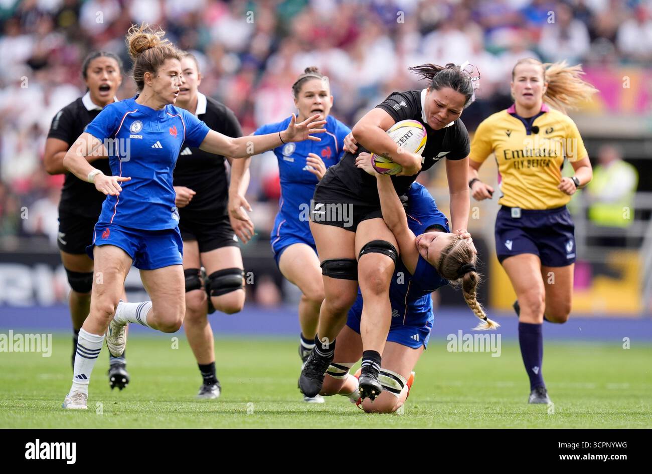 New Zealand's Kaipo Olsen-Baker (centre) is tackled by France's Carla ...