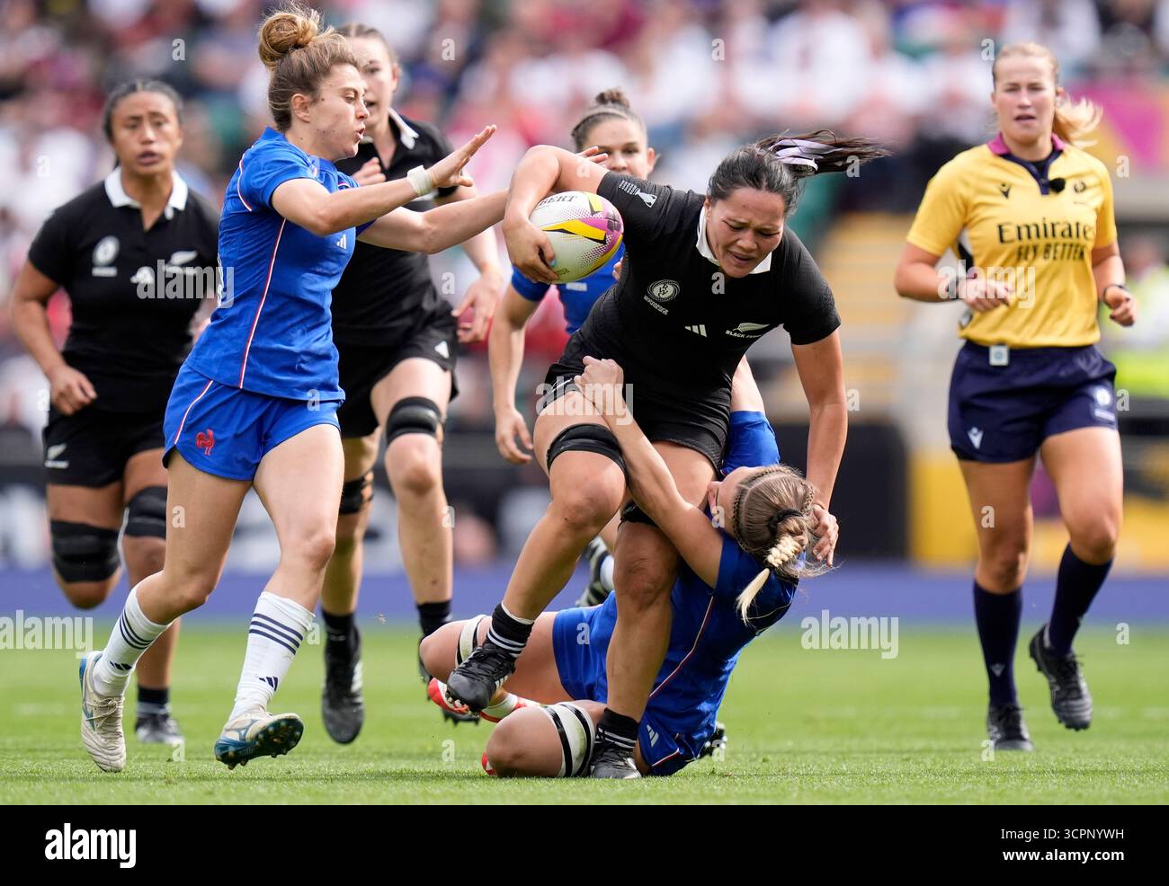 New Zealand's Kaipo Olsen-Baker (centre) is tackled by France's Carla ...