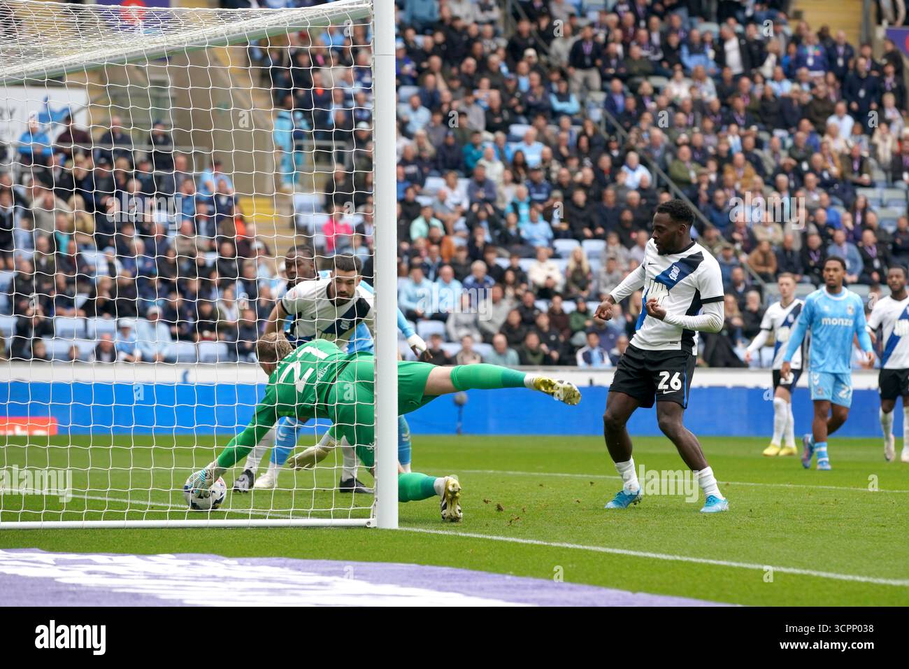 Birmingham City's Bright Osayi-Samuel (right) scores an own goal for ...