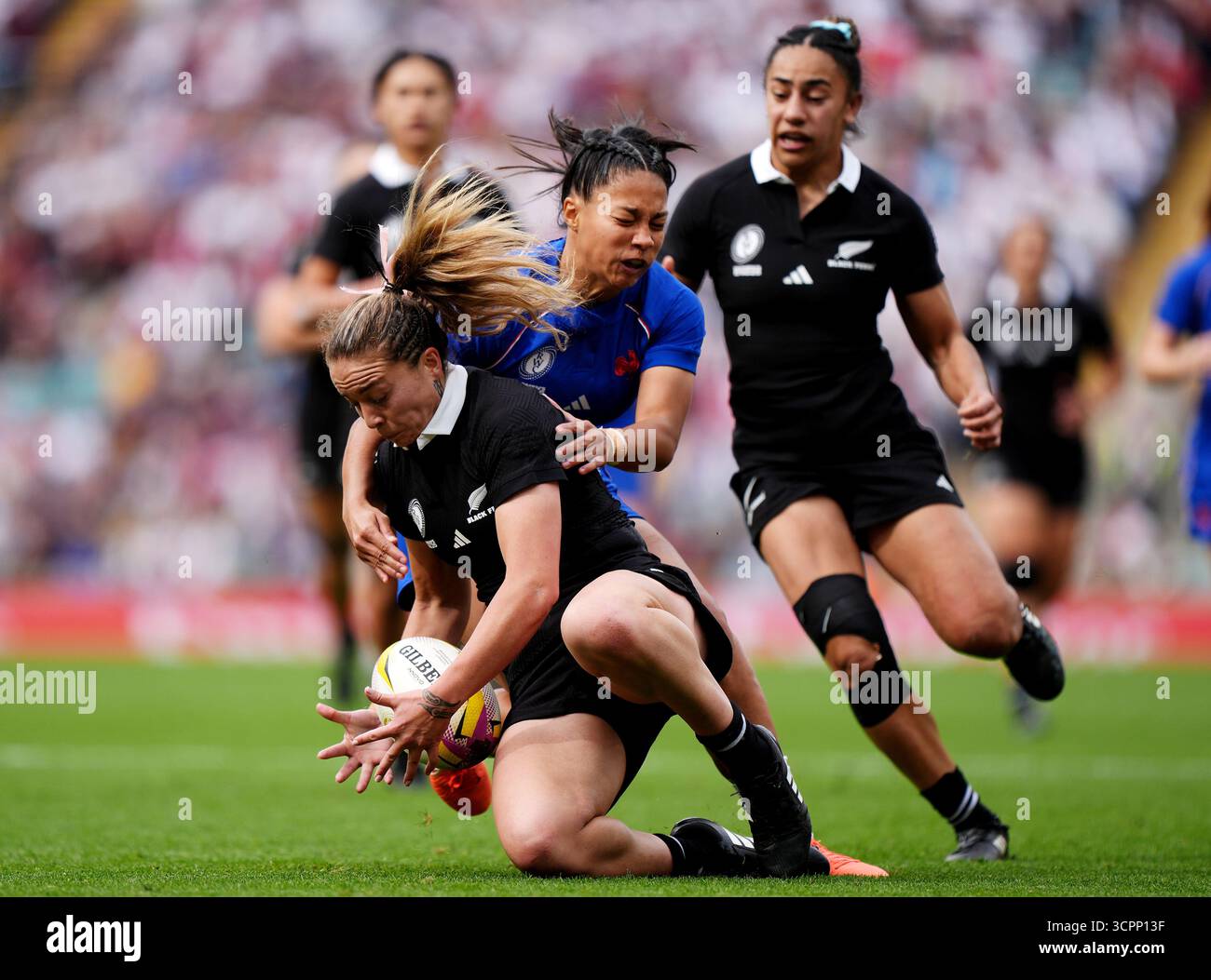 New Zealand's Renee Holmes (left) is tackled by France's Lina Tuy ...