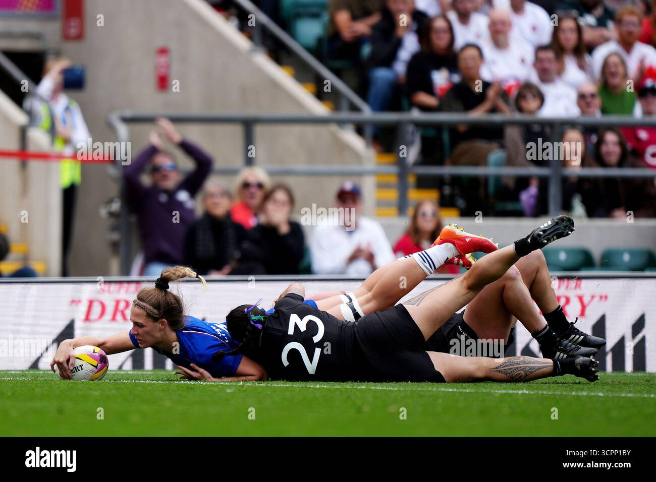 France's Lea Champon (left) scores a try during the Women's Rugby World ...