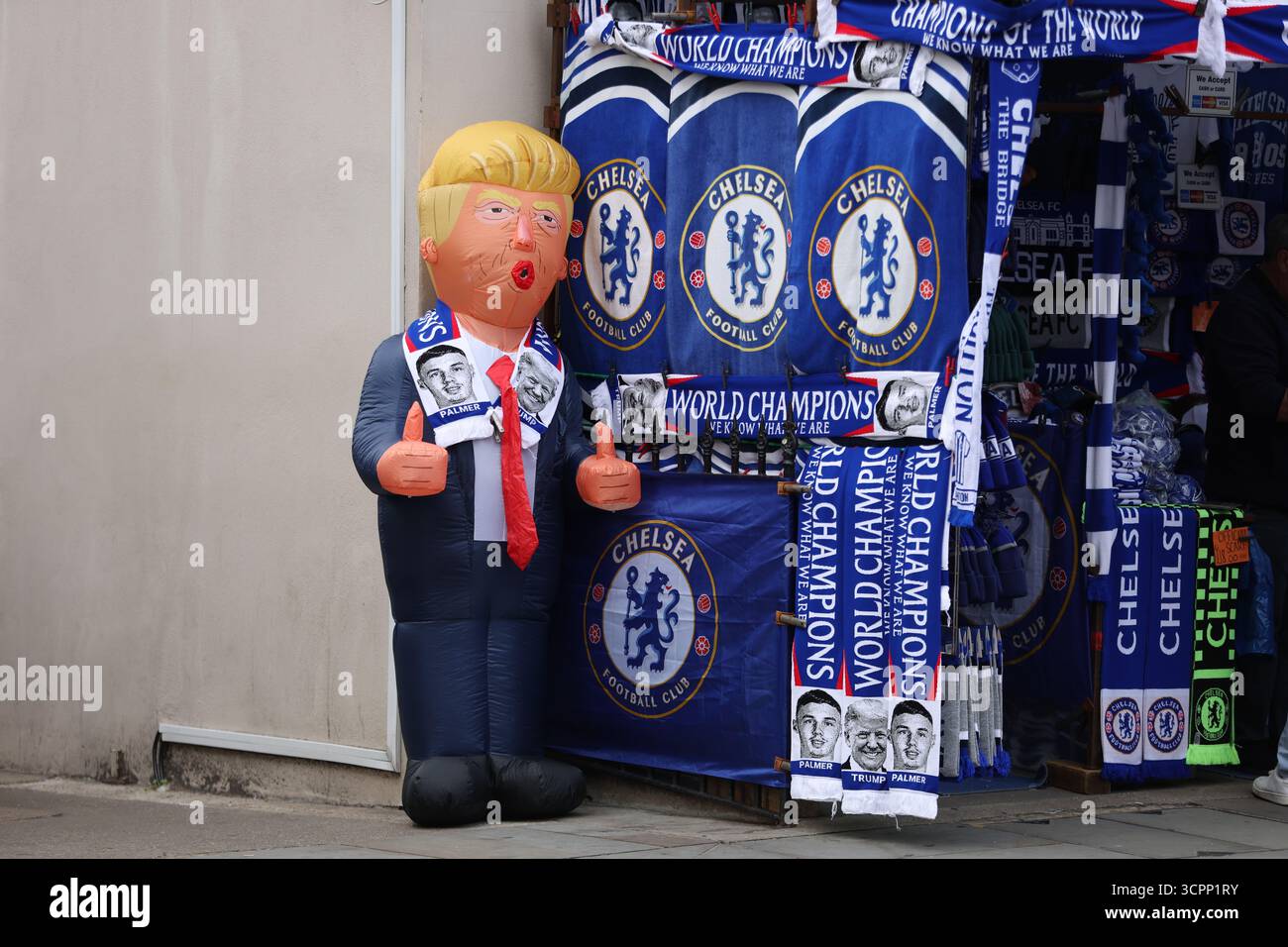 An inflatable doll of US president Donald Trump beside a merchandise ...
