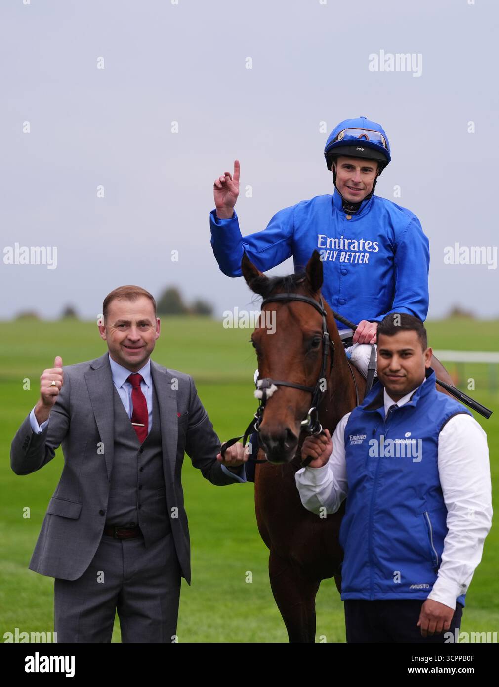 Jockey William Buick on Wise Approach and trainer Charlie Appleby (left ...