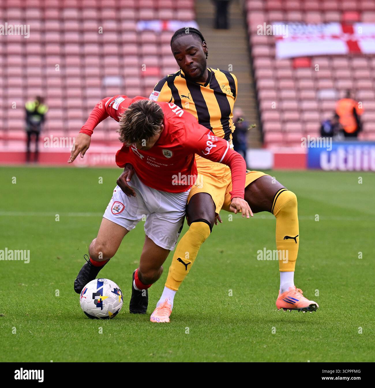 Barnsley's Caylan Vickers battles for the ball against Port Vale's ...