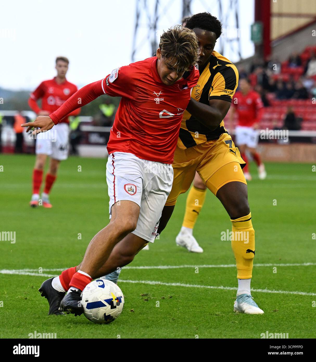 Barnsley's Caylan Vickers battles for the ball against Port Vale's ...