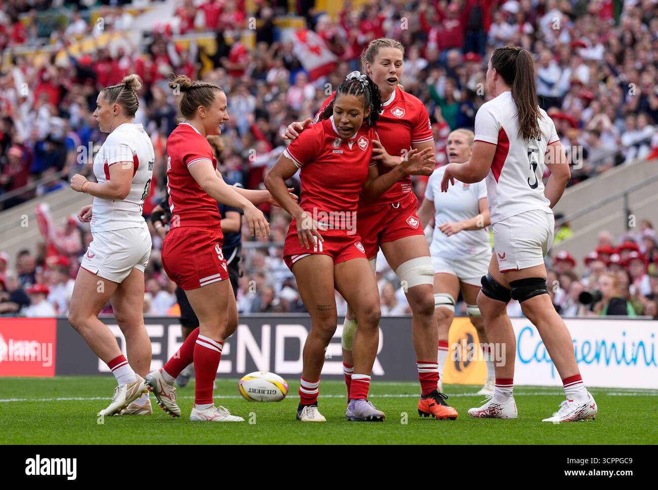 Canada's Asia Hogan-Rochester (centre) celebrates with her team mates ...