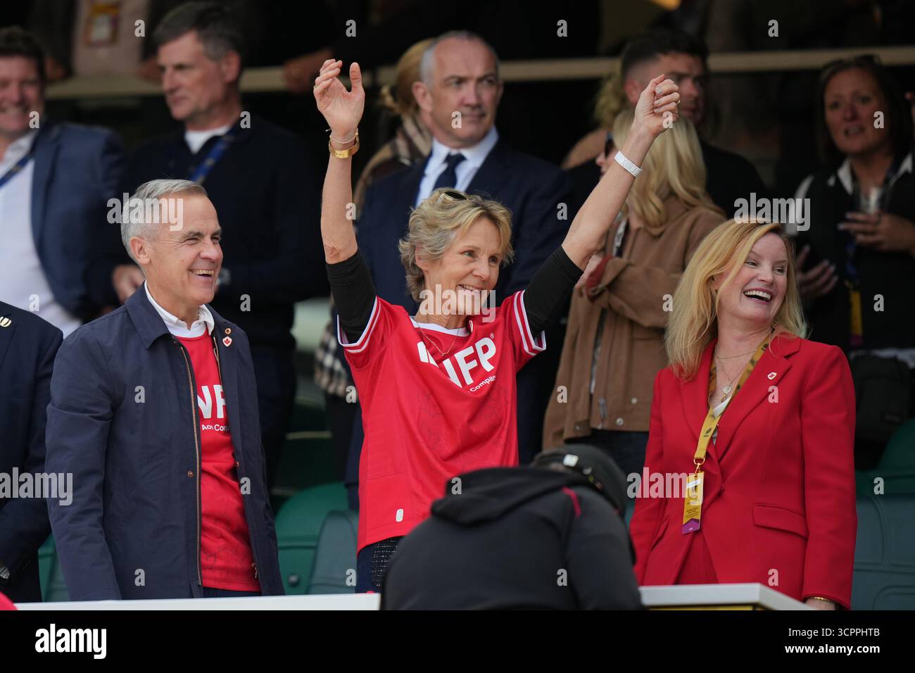 Prime Minister Mark Carney, left, and his wife Diana Fox Carney, centre ...