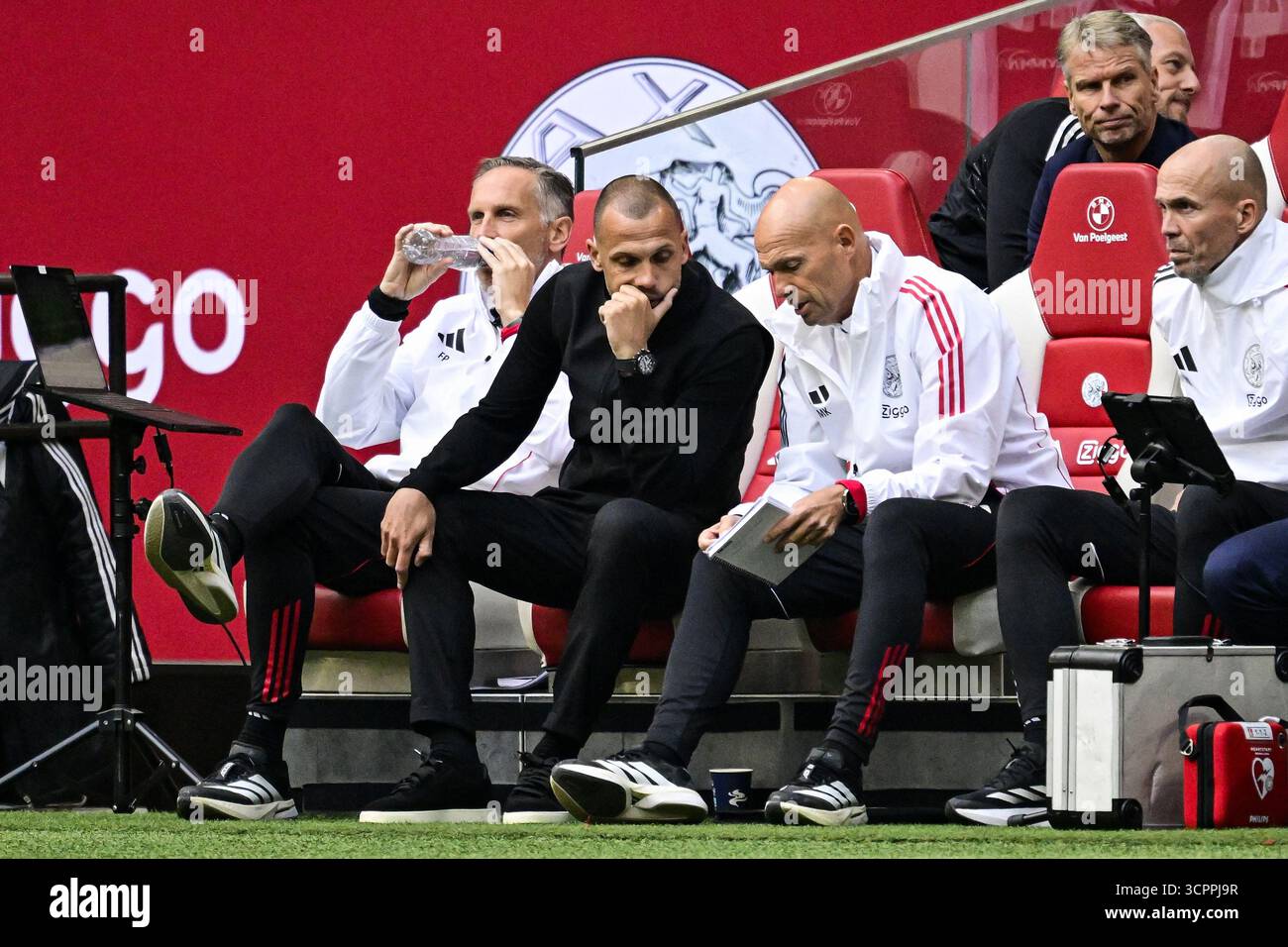 AMSTERDAM – (l-r) Ajax assistant coach Frank Peereboom, Ajax coach Johnny Heitinga, Ajax ...