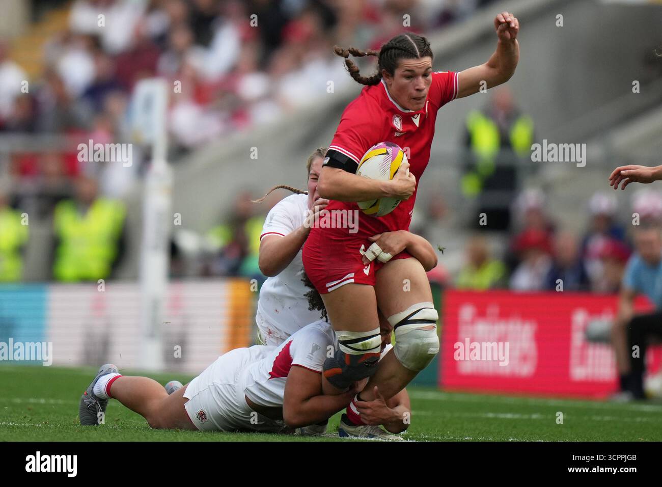 Canada's Fabiola Forteza, top, is tackled by England's players during ...