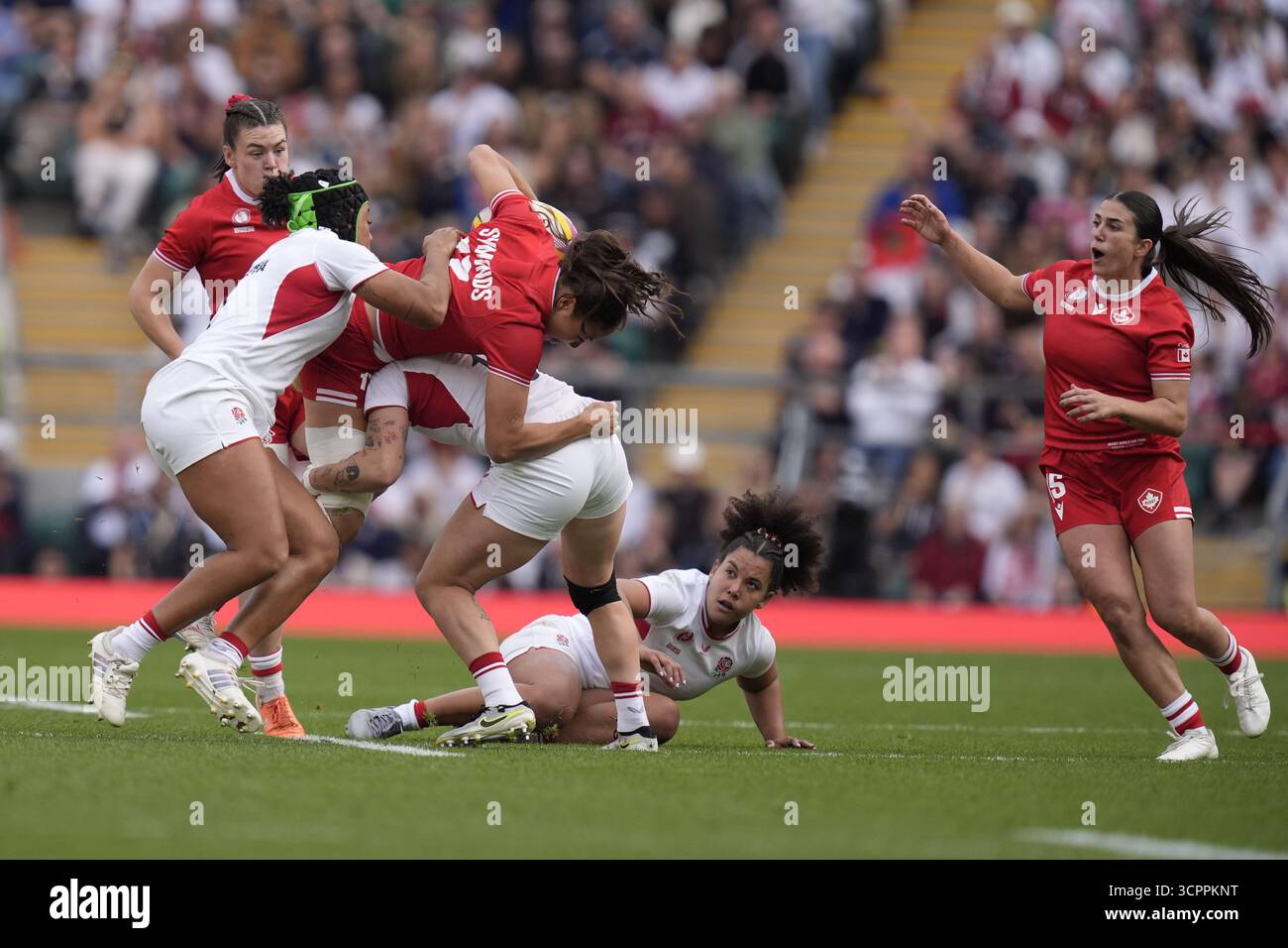 Canada's Florence Symonds (centre left) is tackled by England's Sadia ...