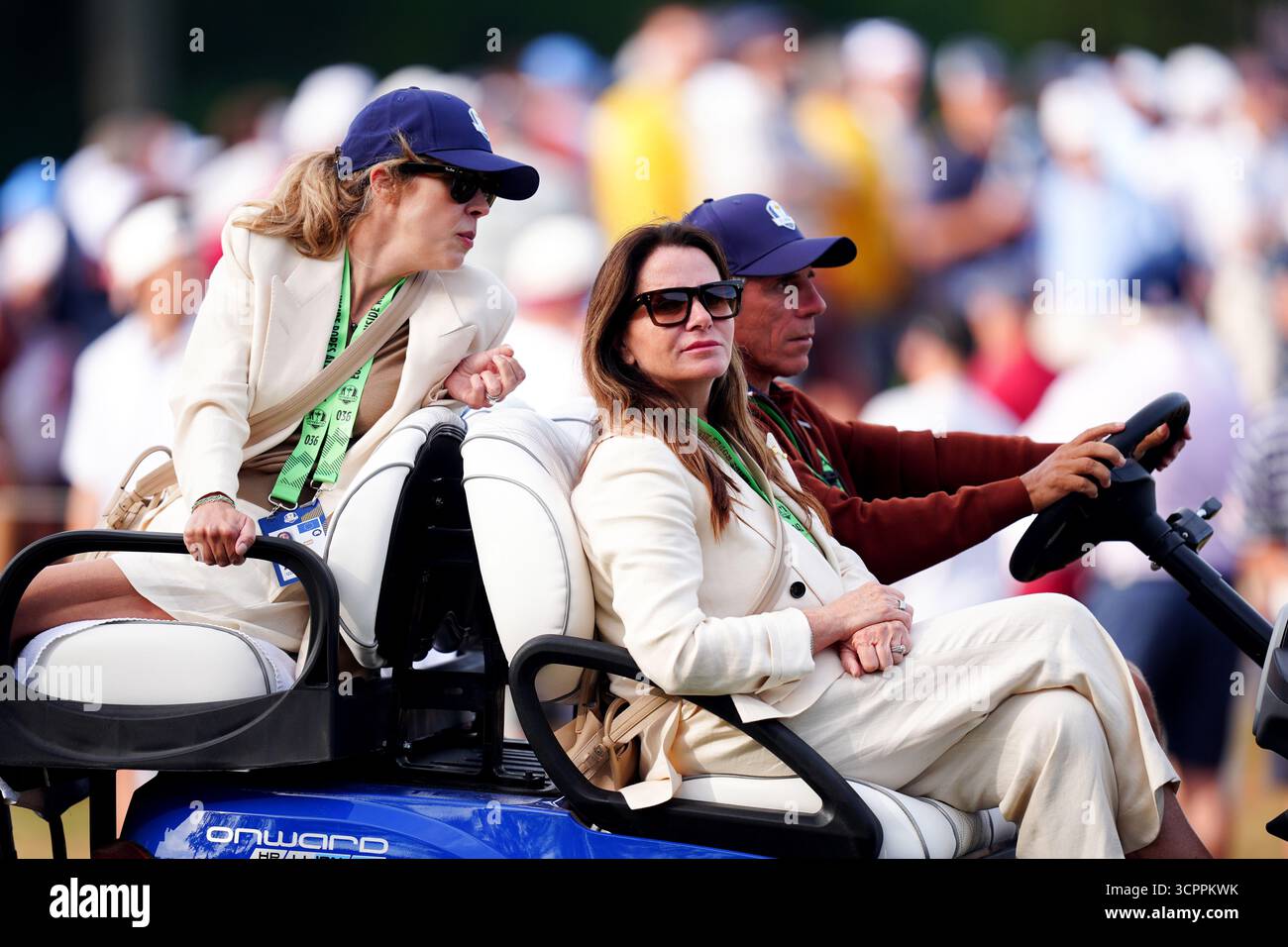 Clare Fleetwood, wife of Tommy Fleetwood, in a golf buggy driven by ...