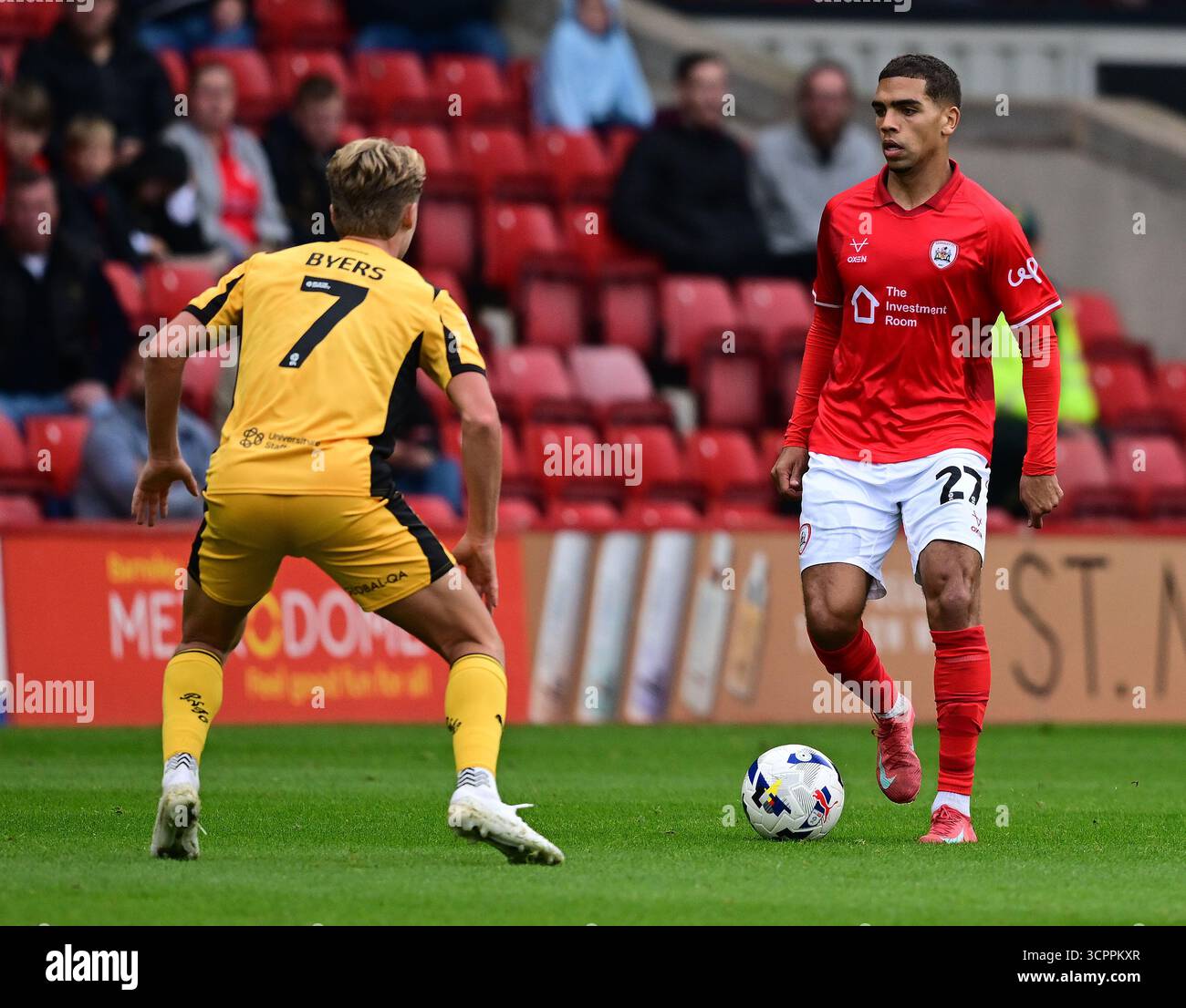 Barnsley's Tennai Watson dribbles with the ball in the match between ...