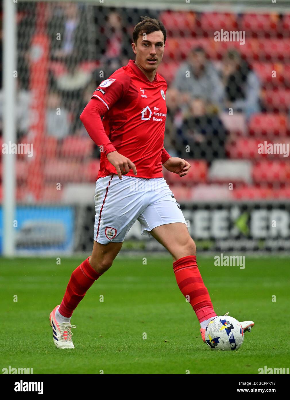 Barnsley's Josh Earl dribbles with the ball in the match between ...
