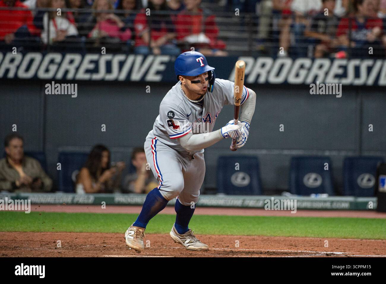 Texas Rangers' Cody Freeman watches his hit against the Cleveland Guardians during the sixth ...