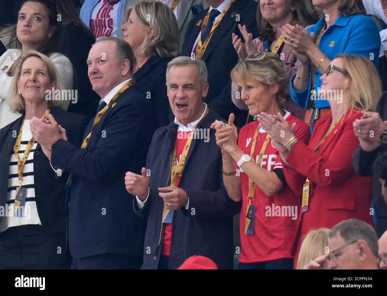 Prime Minister of Canada Mark Carney (centre) and his wife Diana Fox ...