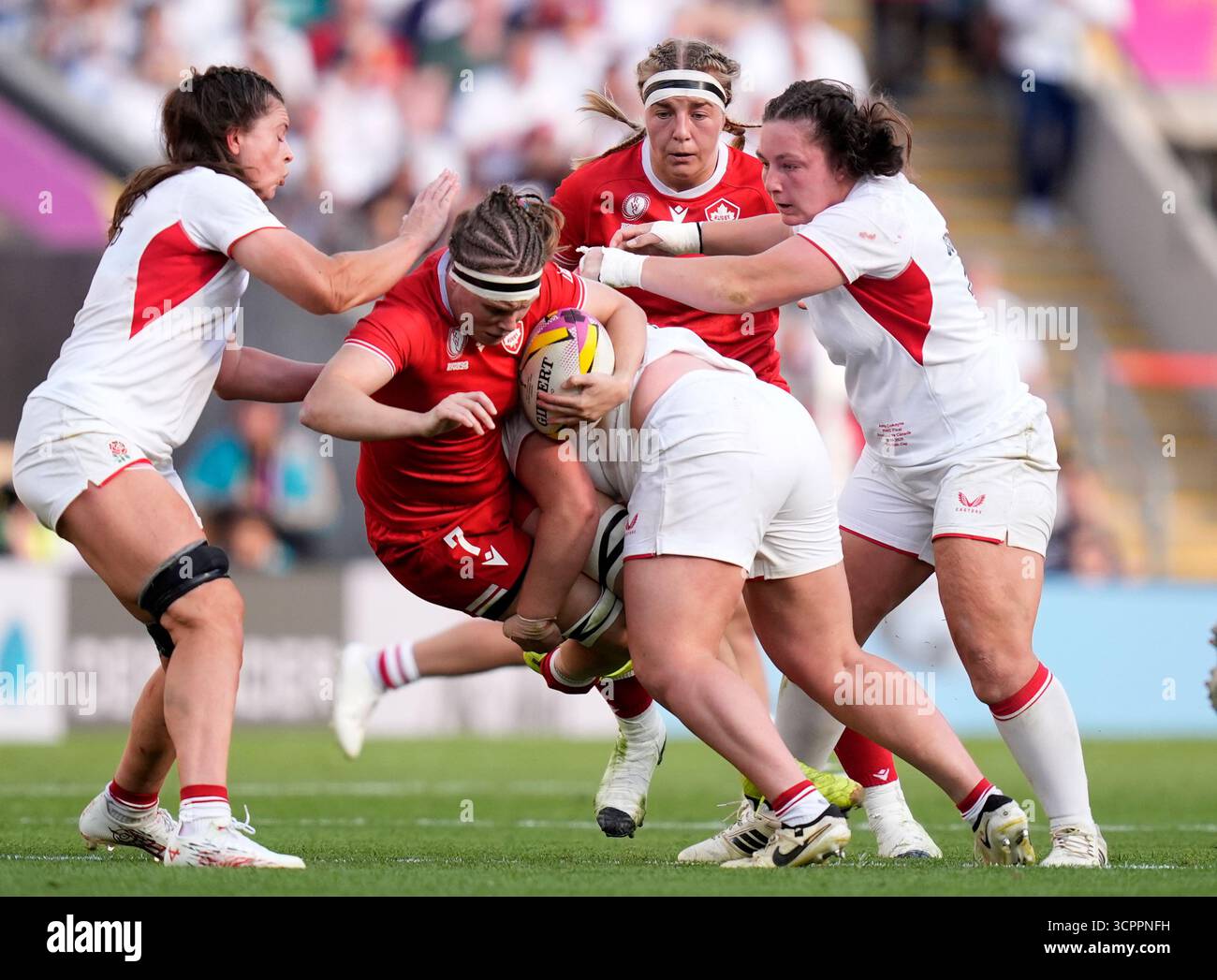 Canada's Karen Paquin (second left) is tackled by England's Maud Muir ...