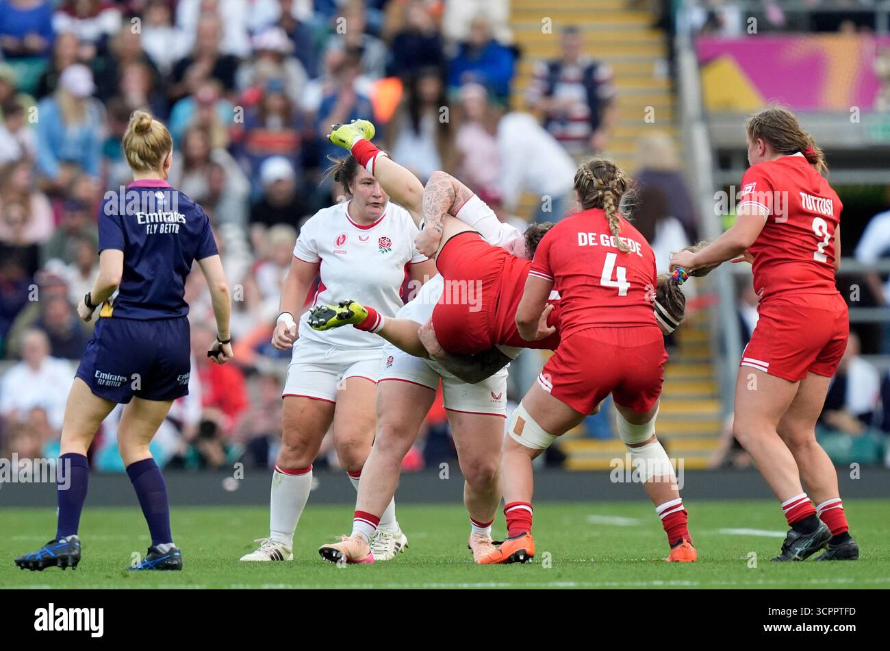 England's Hannah Botterman tackles Canada's Karen Paquin which lead to ...