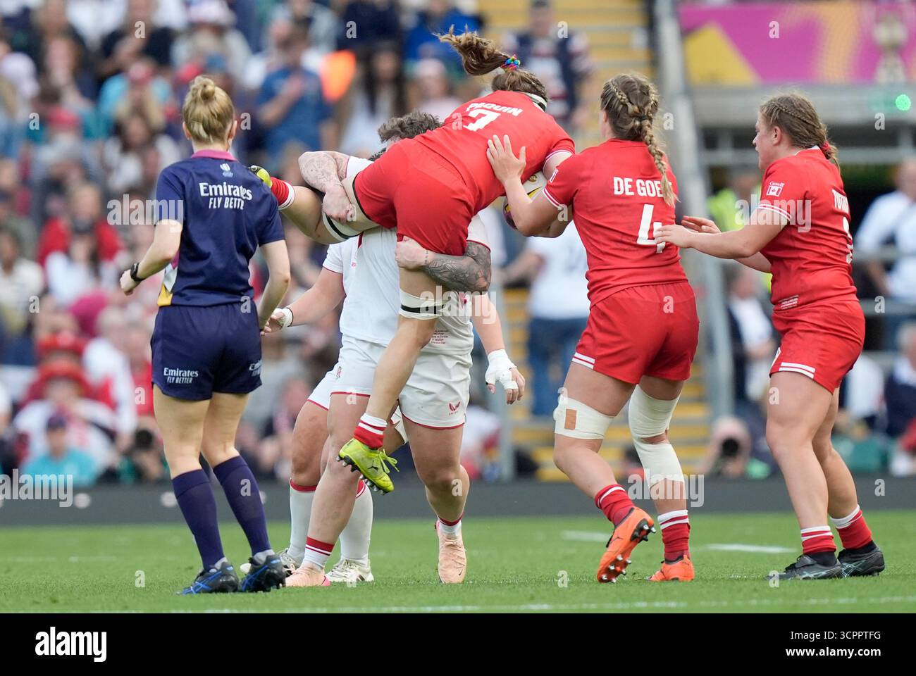 England's Hannah Botterman tackles Canada's Karen Paquin which lead to ...