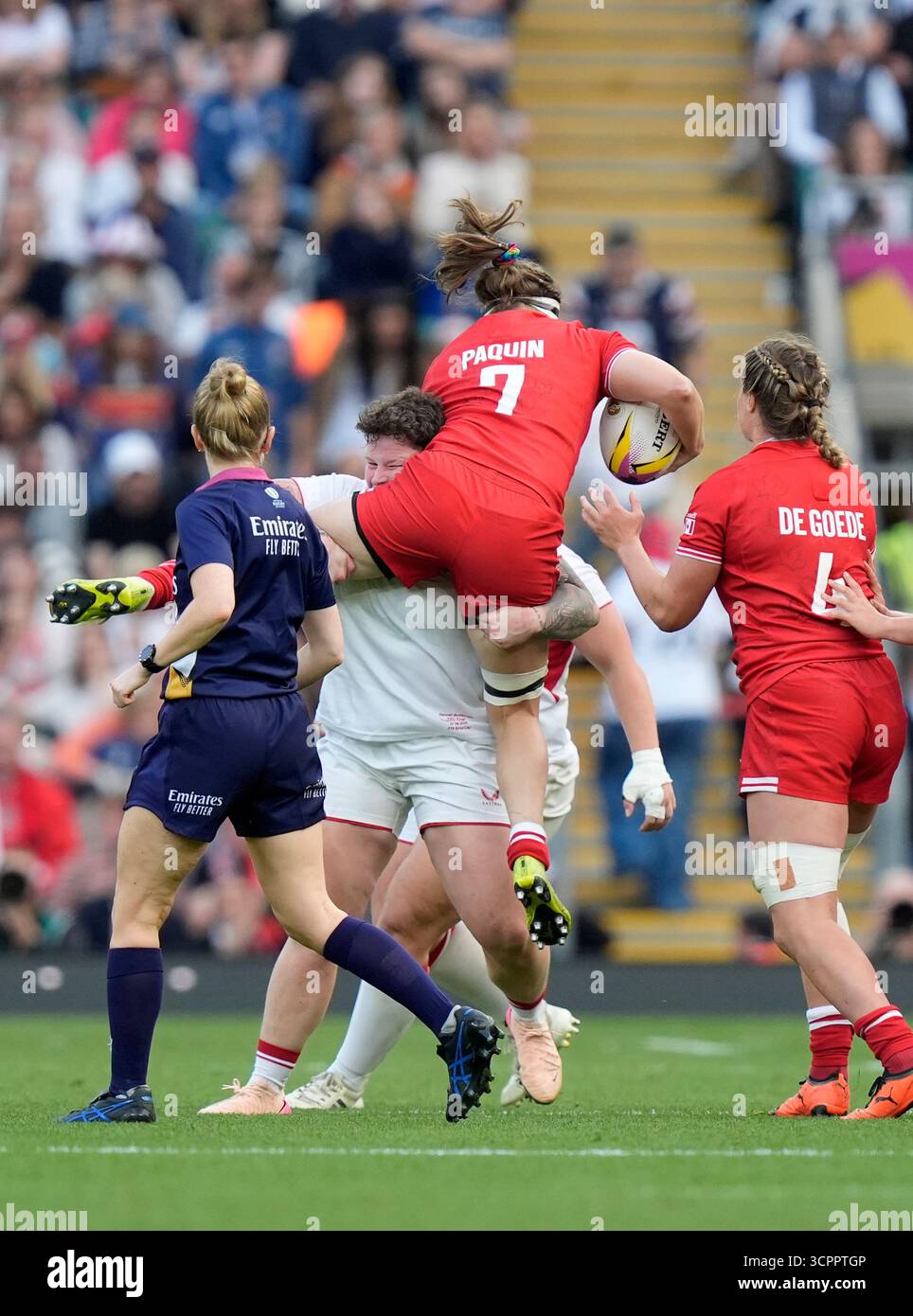 England's Hannah Botterman tackles Canada's Karen Paquin which lead to ...