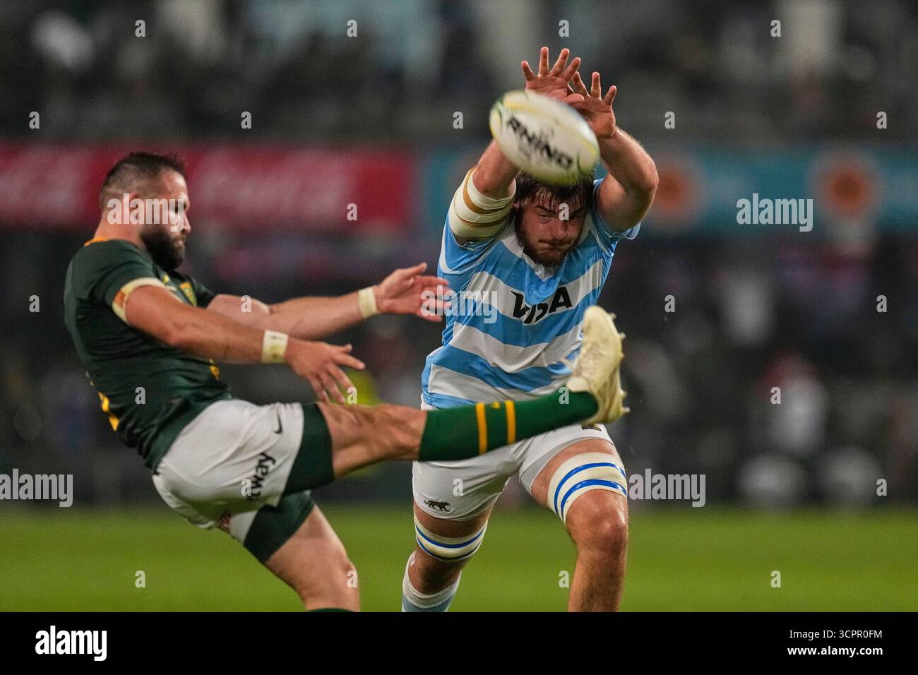 Argentina's Pedro Rubiolo, right, blocks a kick by South Africa's Cobus ...