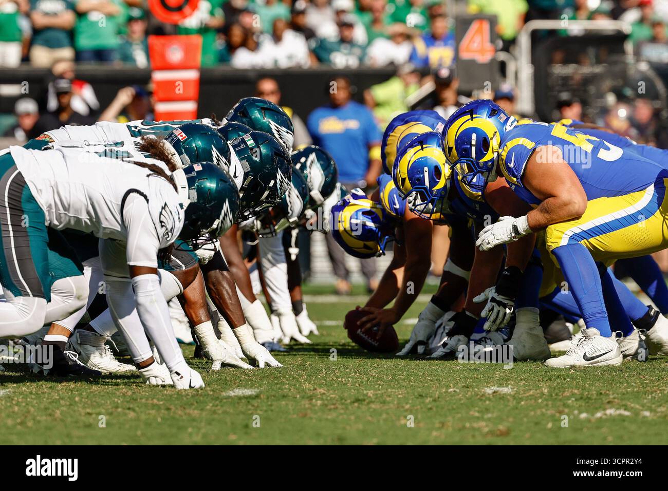 The Philadelphia Eagles and the Los Angeles Rams line up for the snap ...