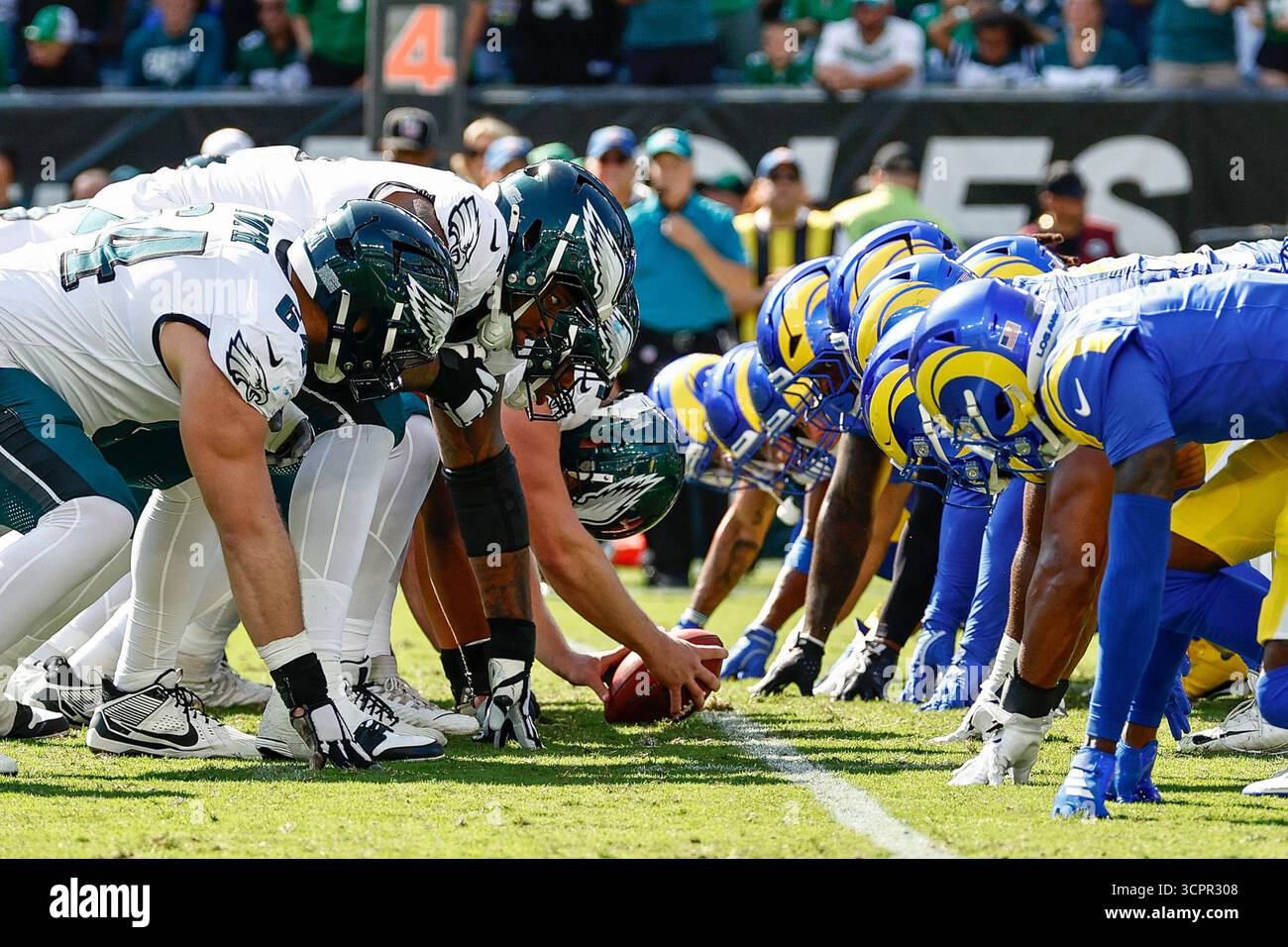 The Philadelphia Eagles and the Los Angeles Rams line up for the snap ...