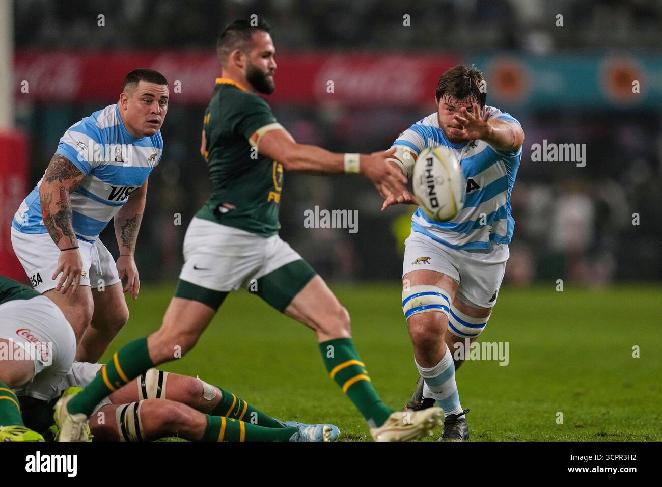 Argentina's Pedro Rubiolo, right, blocks a kick by South Africa's Cobus ...