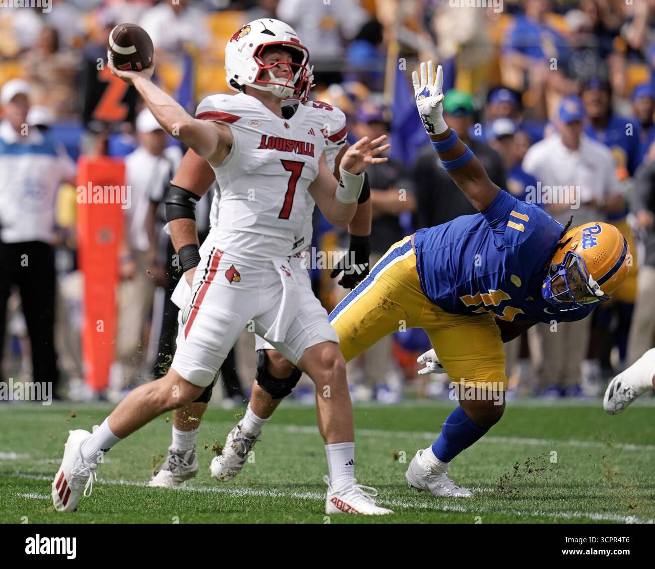 Louisville Cardinals quarterback Miller Moss (7) pass under pressure by ...
