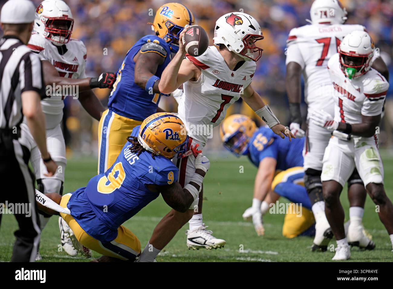 Louisville quarterback Miller Moss (7) tries to get a pass off under ...