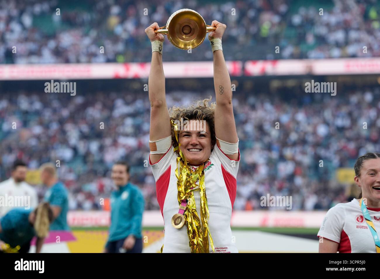 England's Ellie Kildunne lifts the Women's Rugby World trophy after the ...