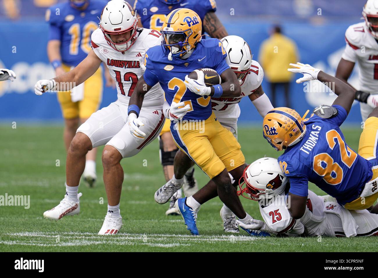 Pittsburgh running back Ja'Kyrian Turner (25) is brought down by ...