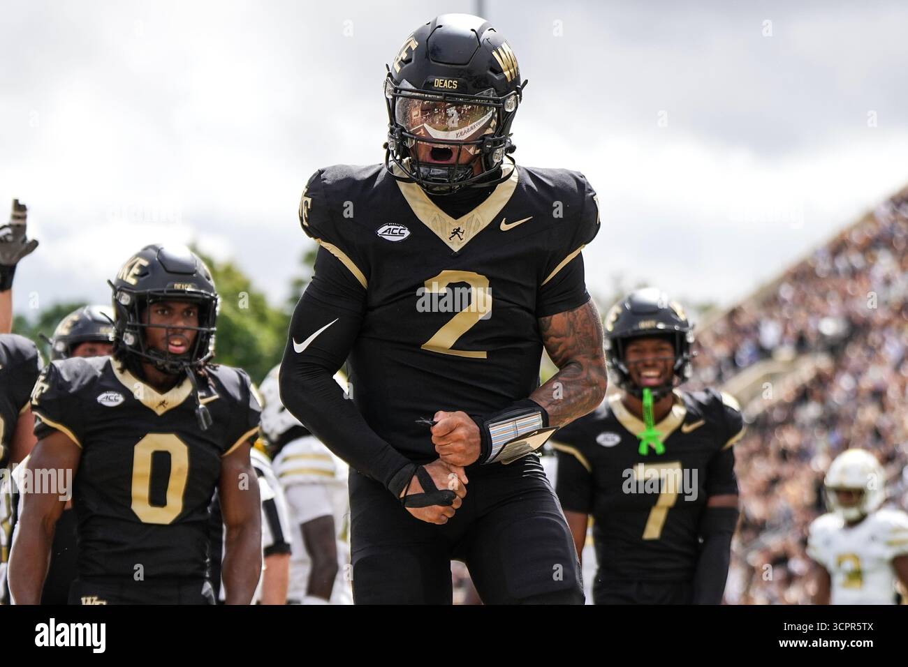 Wake Forest quarterback Robby Ashford (2) celebrates after scoring a ...