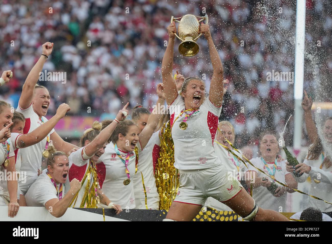 England's Zoe Aldcroft holds a trophy as she celebrates with her ...