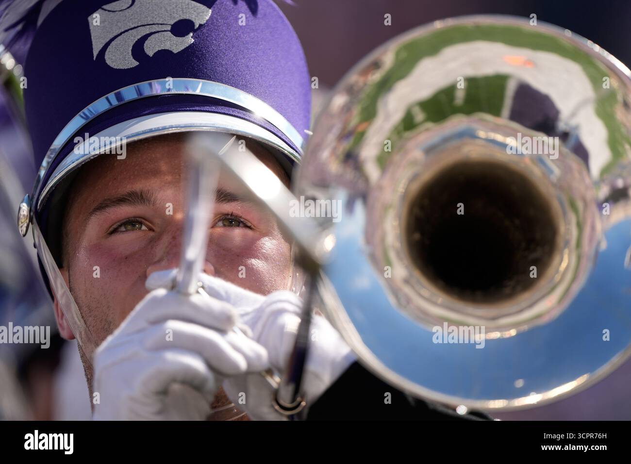 A member of the Kansas State band plays before an NCAA college football ...