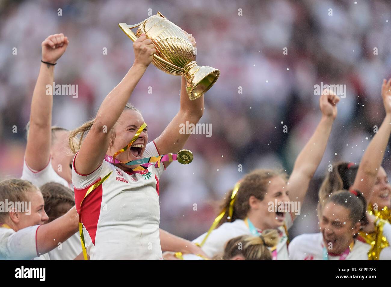 England's players celebrate as Zoe Aldcroft lifts the Women's Rugby ...