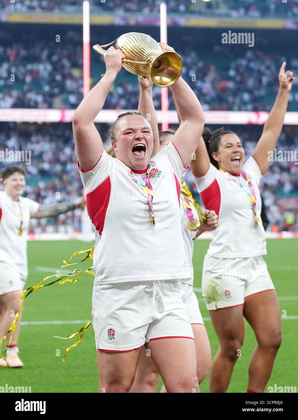 England's Sarah Bern (centre) lifts the trophy as she celebrates with ...