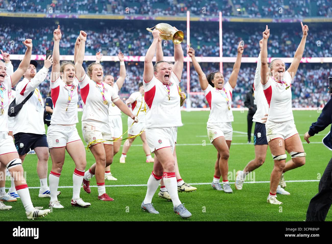 England's Sarah Bern (centre) lifts the trophy as she celebrates with ...