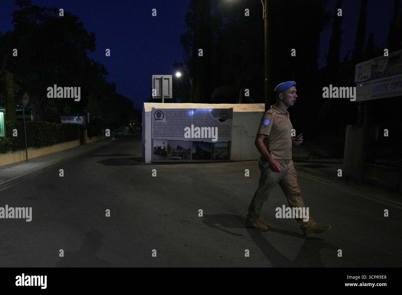 A UN peacekeeper walk next of thet Ledra Palace hotel checkpoint inside ...