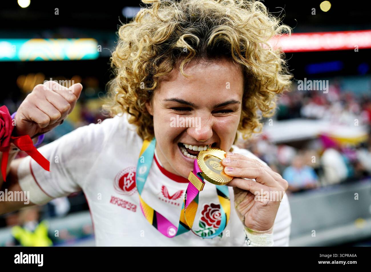 England's Ellie Kildunne bites her winners medal as she celebrates ...