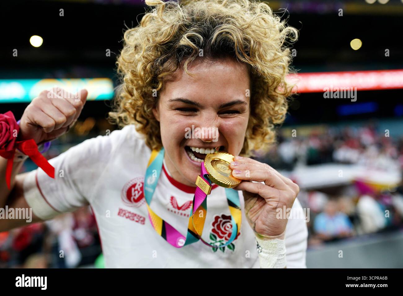 England's Ellie Kildunne bites her winners medal as she celebrates ...