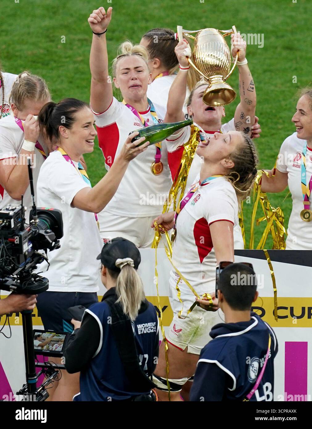 England's Zoe Aldcroft drinks from a bottle as her players celebrate ...