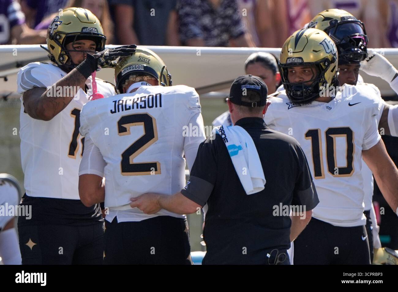 Central Florida quarterback Tayven Jackson (2) is helped off the field ...