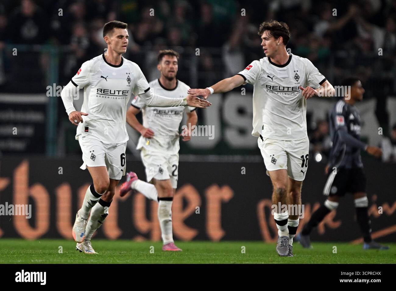 Mönchengladbach's Yannik Engelhardt, left, celebrates scoring with ...