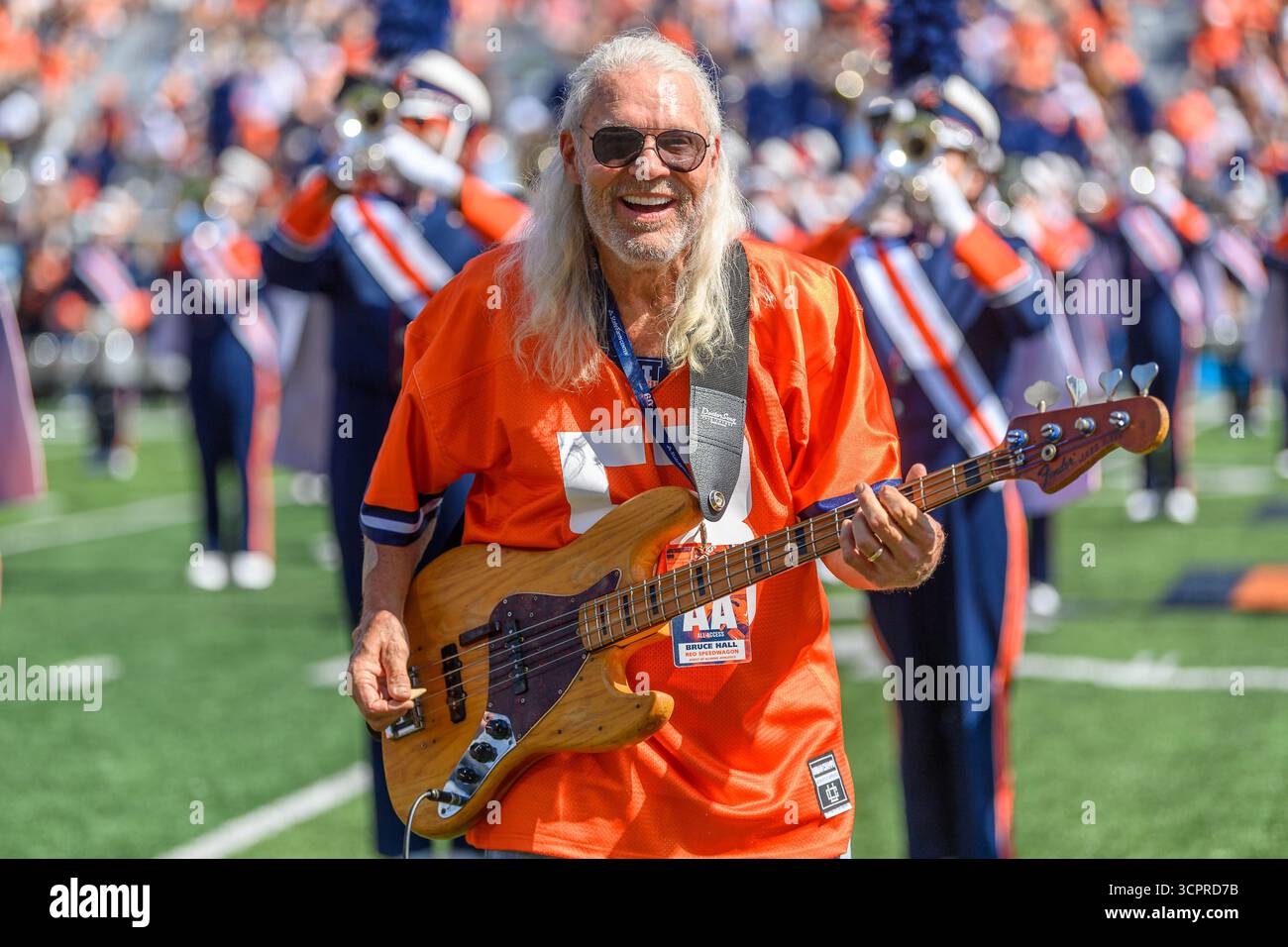 REO Speedwagon's Bruce Hall performs with the Marching Illini band ...