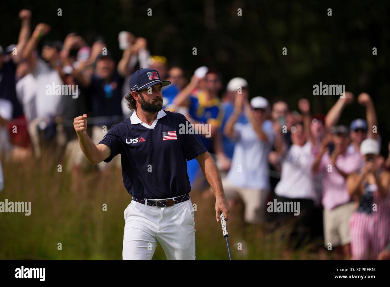 United States' Cameron Young celebrates after a putt on the seventh ...